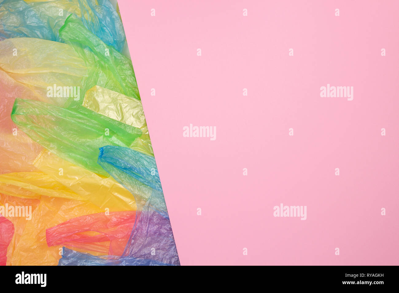 Multicolored single use plastic shopping bags with blank pink ...