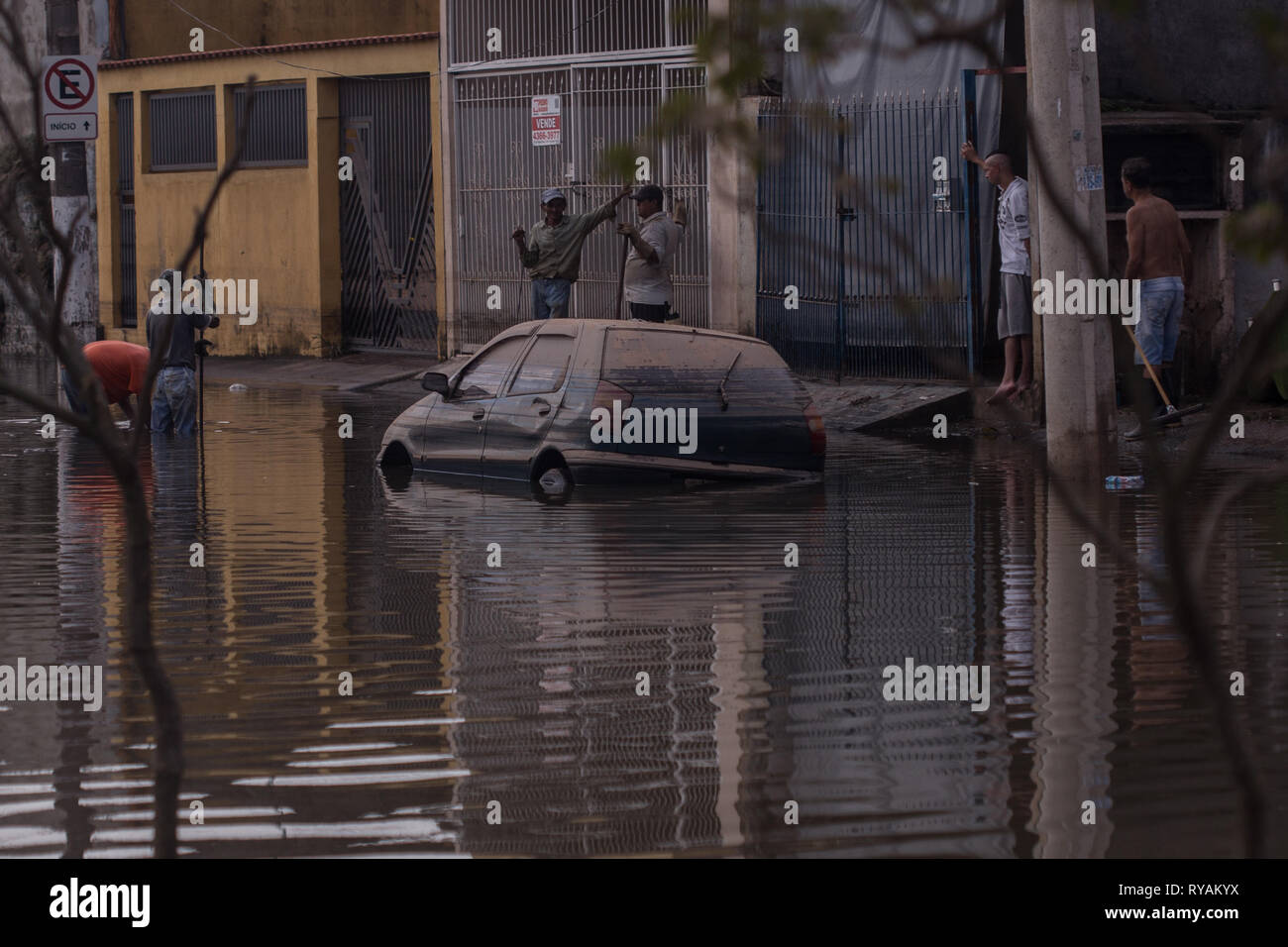 Sao Paulo, Brazil. 12th Mar, 2019. There's a car in a flooded street ...