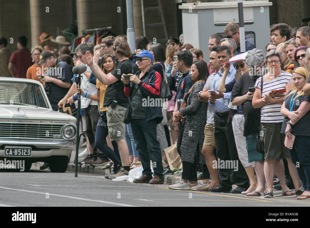 Adelaide, Australia. 13th Mar, 2019. Crowds watch the film set of ...