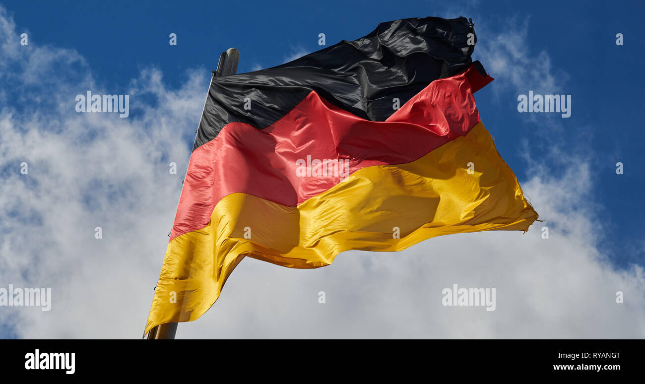 Berlin, Germany. 12th Mar, 2019. The German flag blows on the Bundestag ...