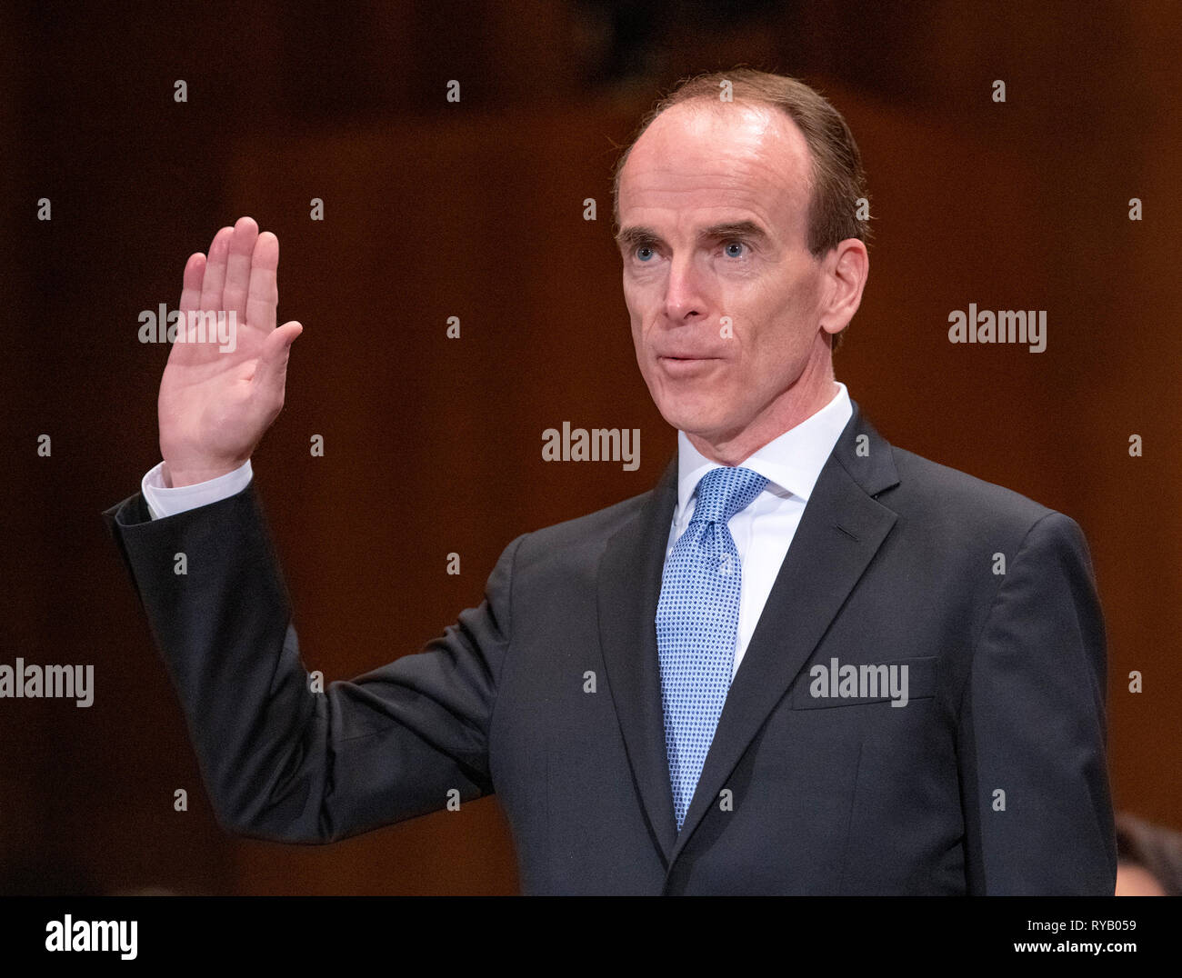 Washington DC, USA. 13th Mar, 2019. Daniel P. Collins is sworn-in to ...