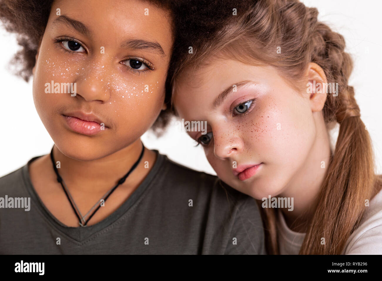 Pretty young kids having their freckles painted on Stock Photo - Alamy
