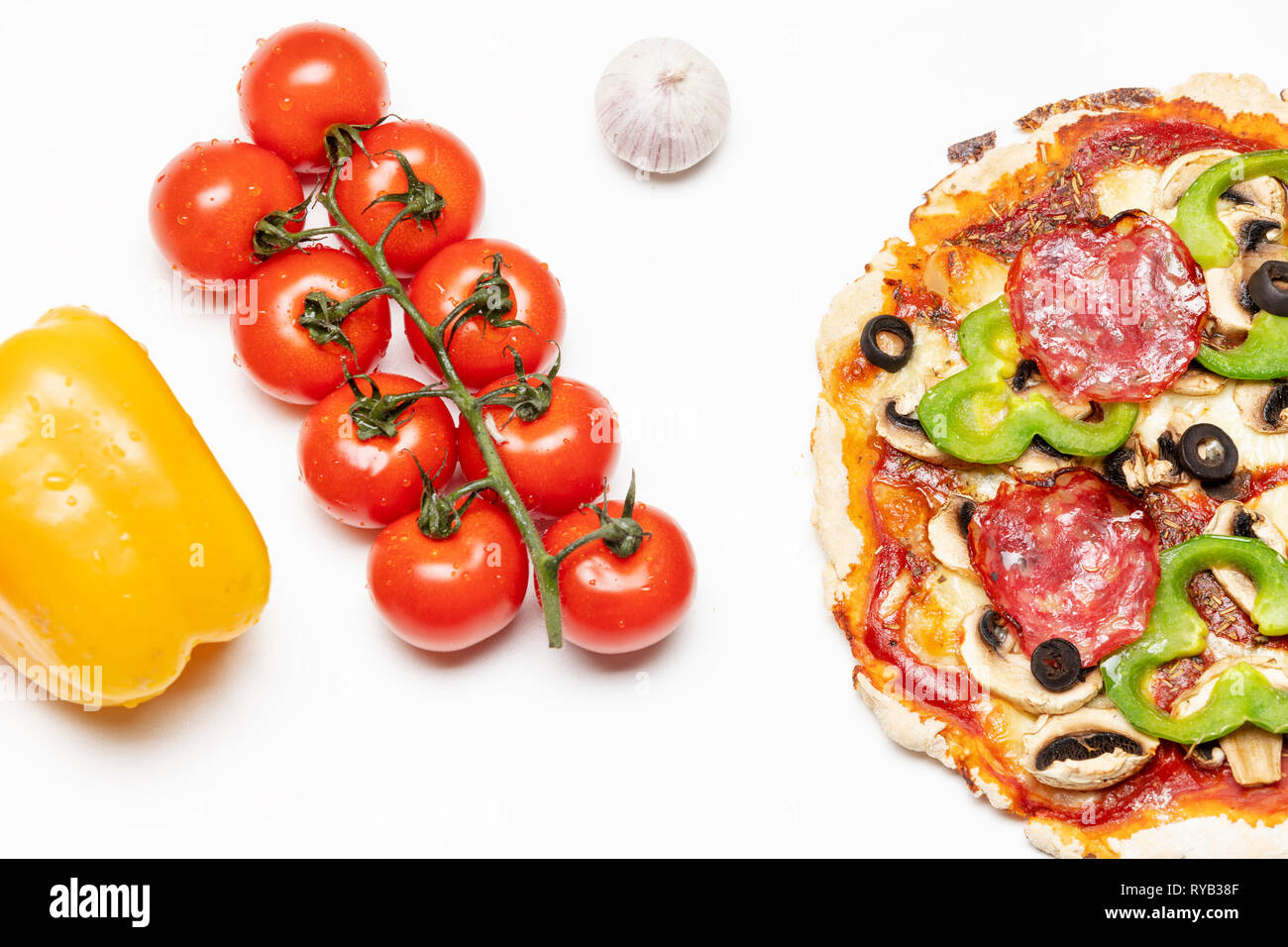 overview of a fresh pizza on white Stock Photo - Alamy