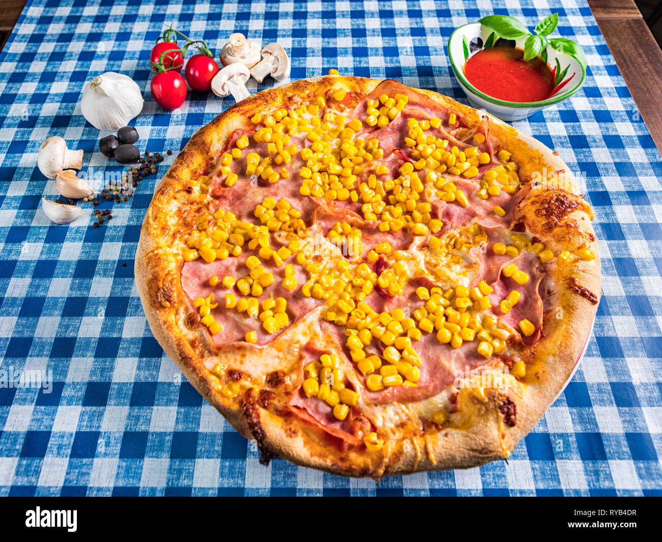 sweetcorn and ham pizza with cheese Stock Photo - Alamy