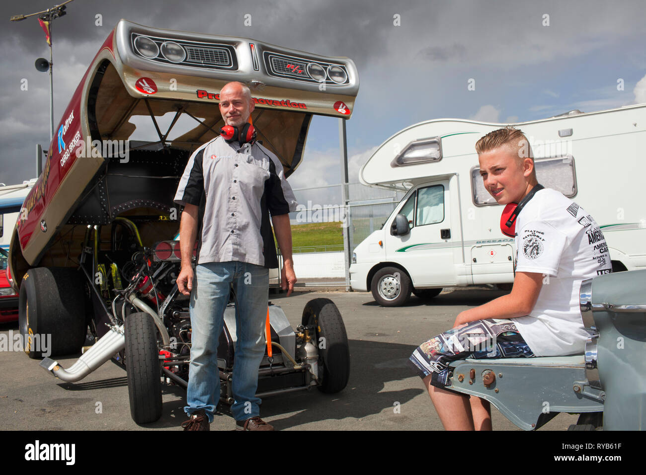 A family enjoy a day out among the cars at Santa Pod Stock Photo - Alamy