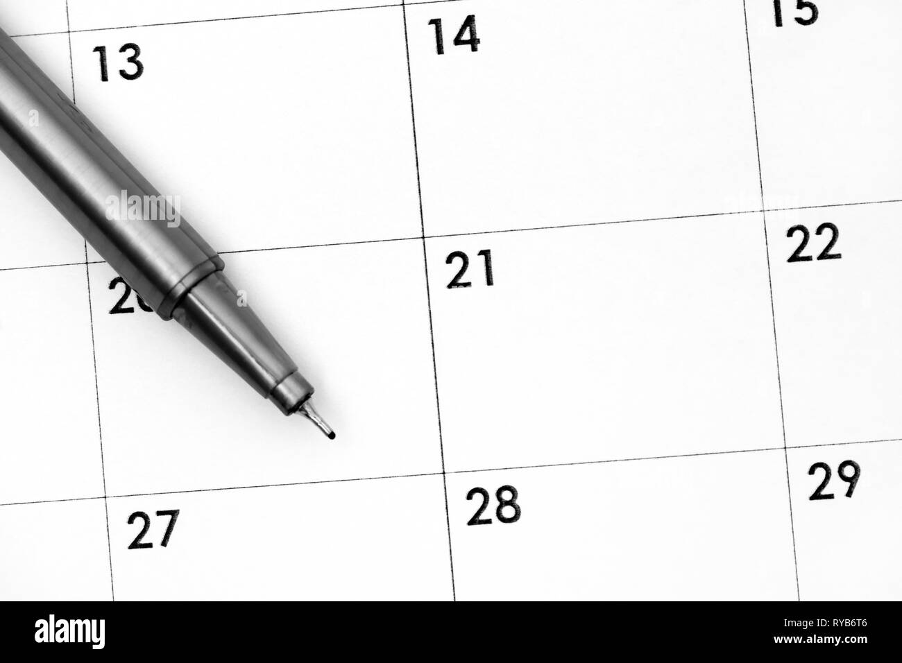 Calendar page with pen. Close-up Stock Photo - Alamy