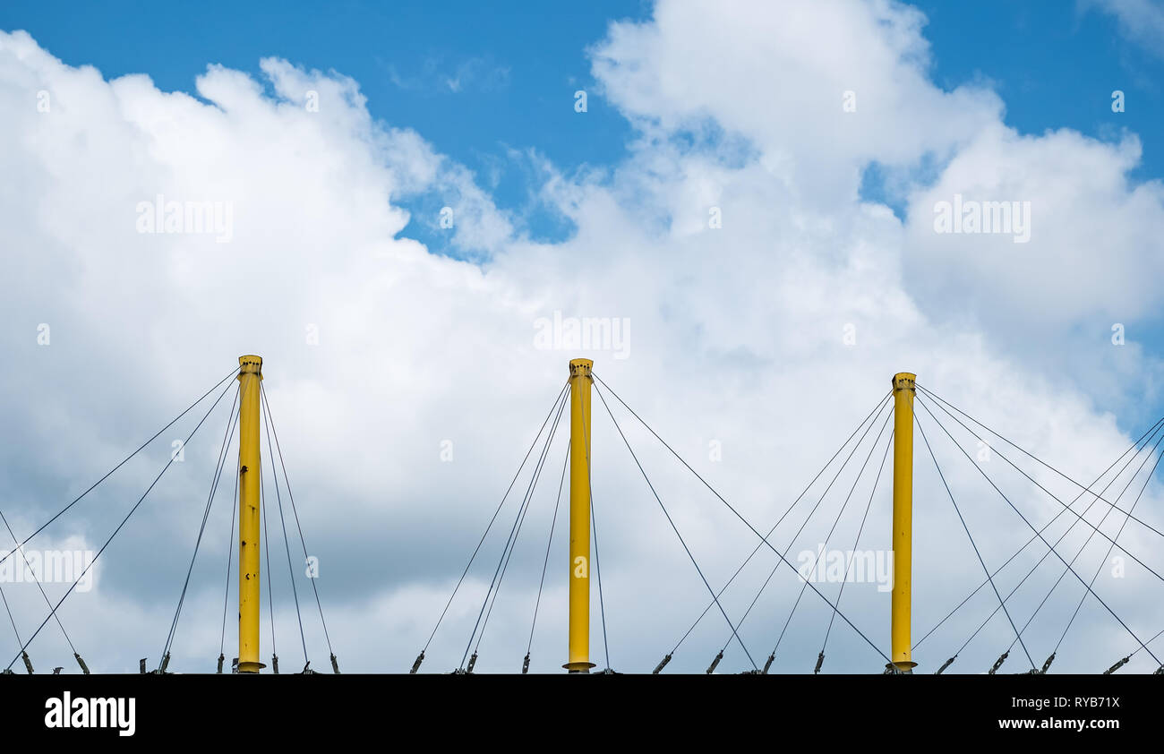 yellow metal posts with anchor support Stock Photo - Alamy
