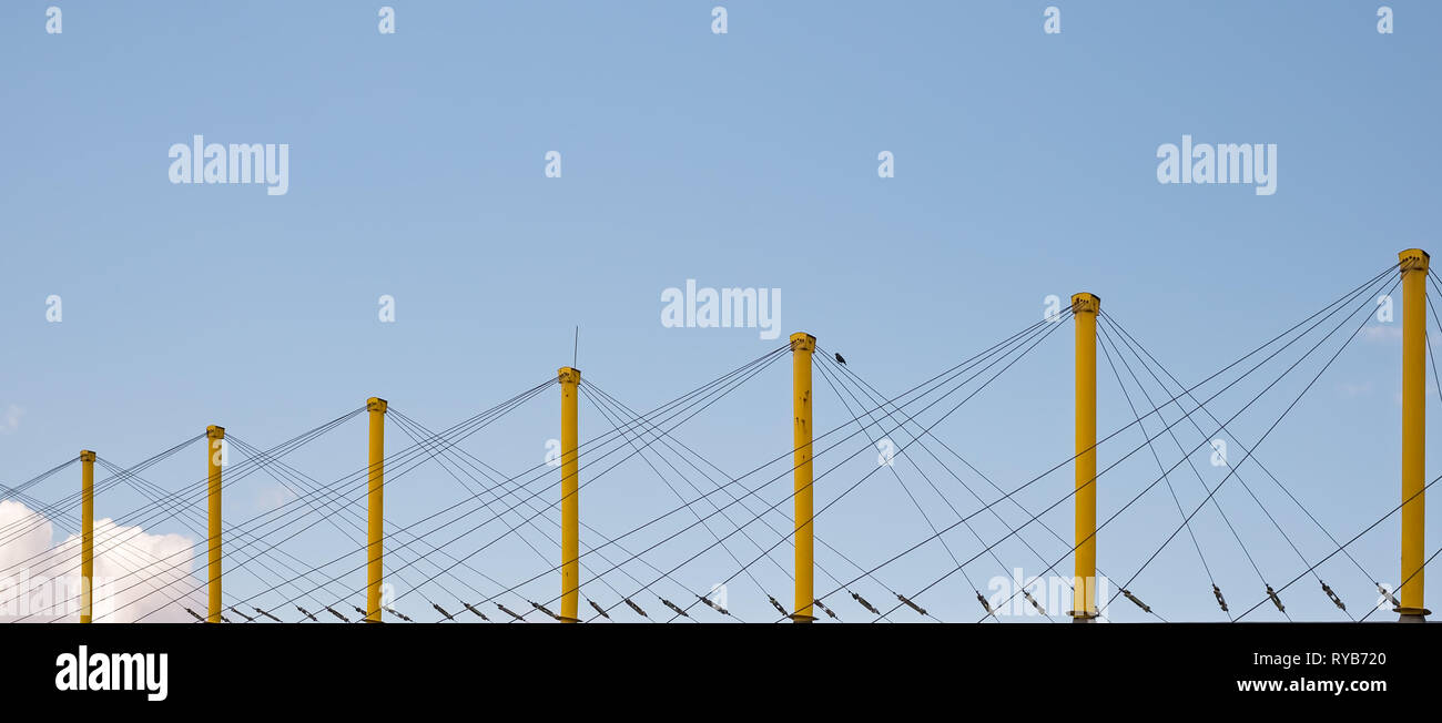 yellow metal posts with anchor support Stock Photo - Alamy
