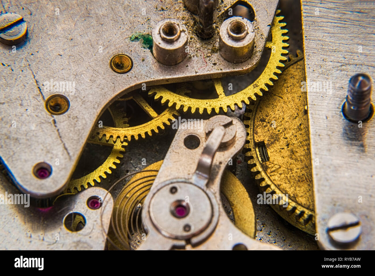 Clockwork old mechanical watch with dust Stock Photo - Alamy