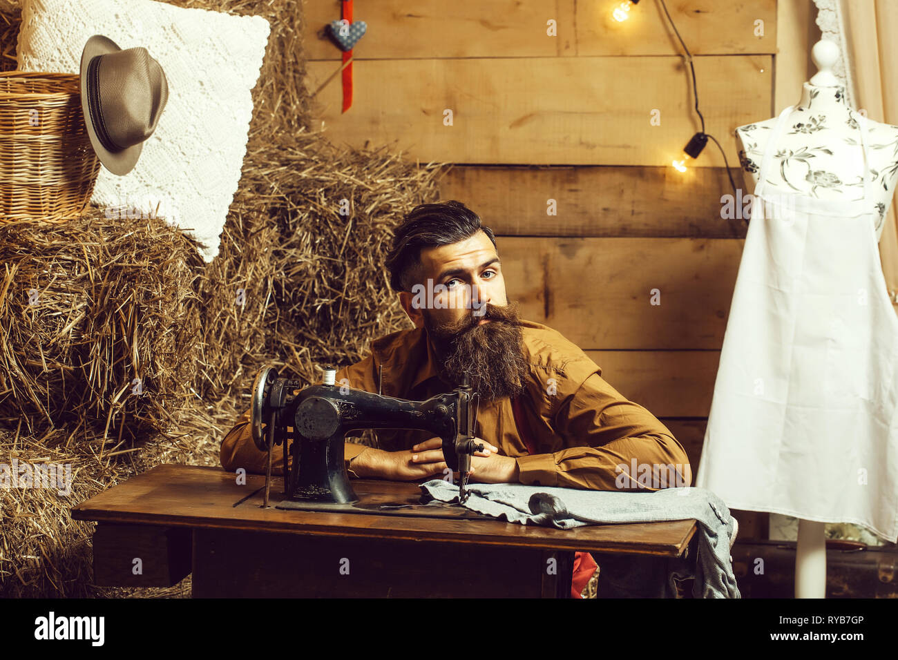 Sewing machine man sews clothes hi-res stock photography and images - Alamy