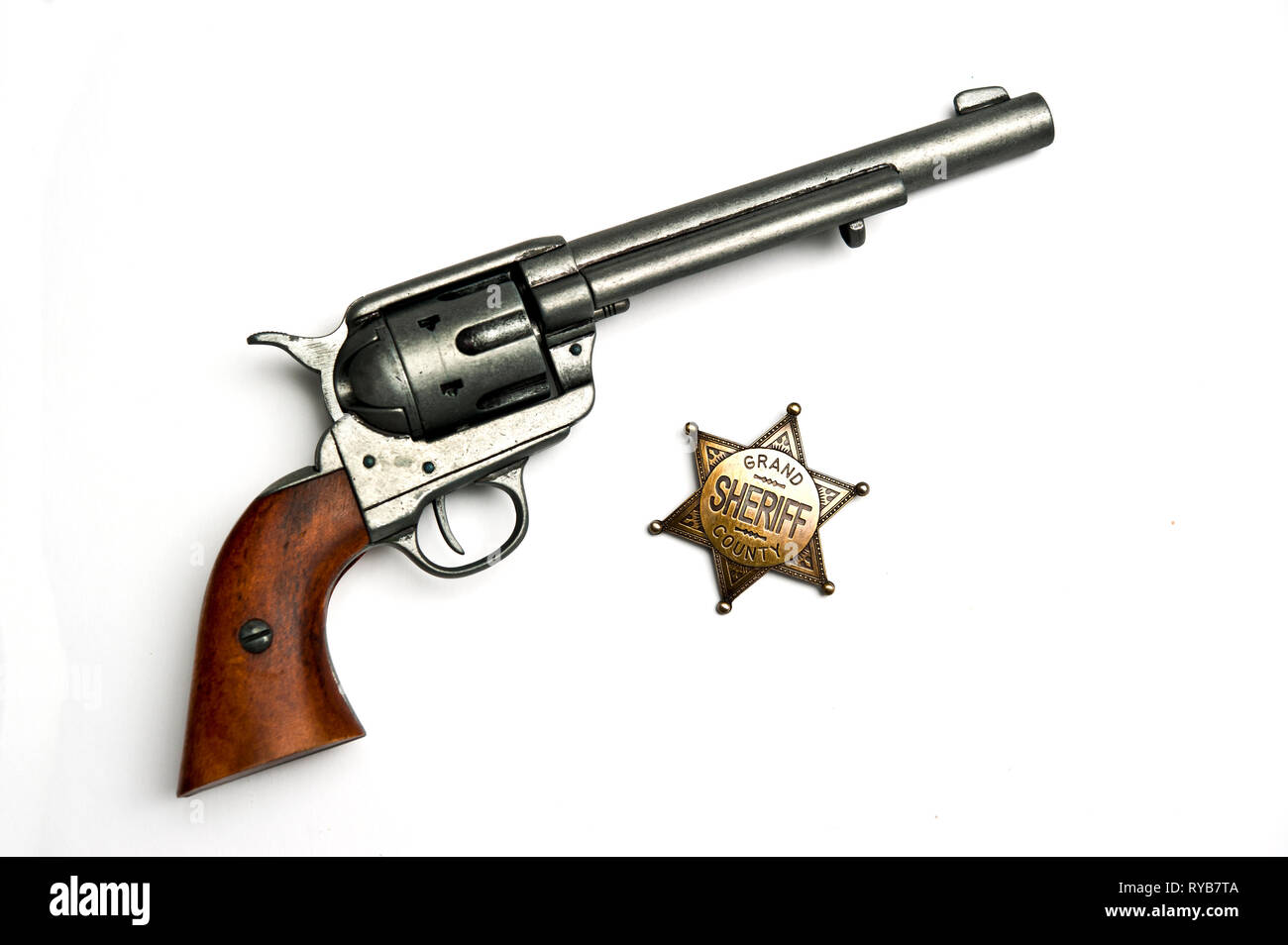 Colt.45 single action gun and sheriff badge Stock Photo - Alamy