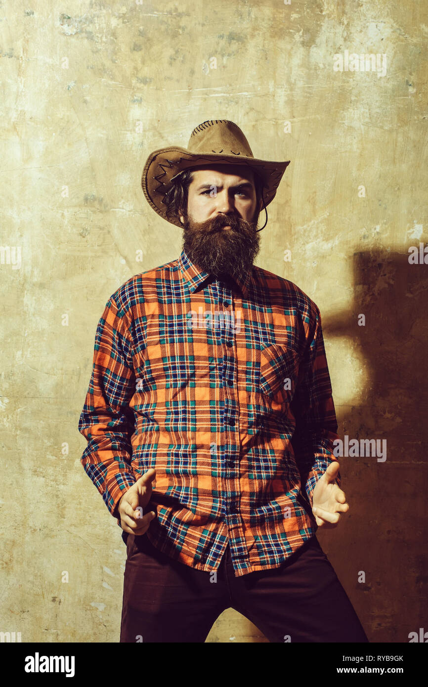 Bearded man with long beard in cowboy hat Stock Photo - Alamy
