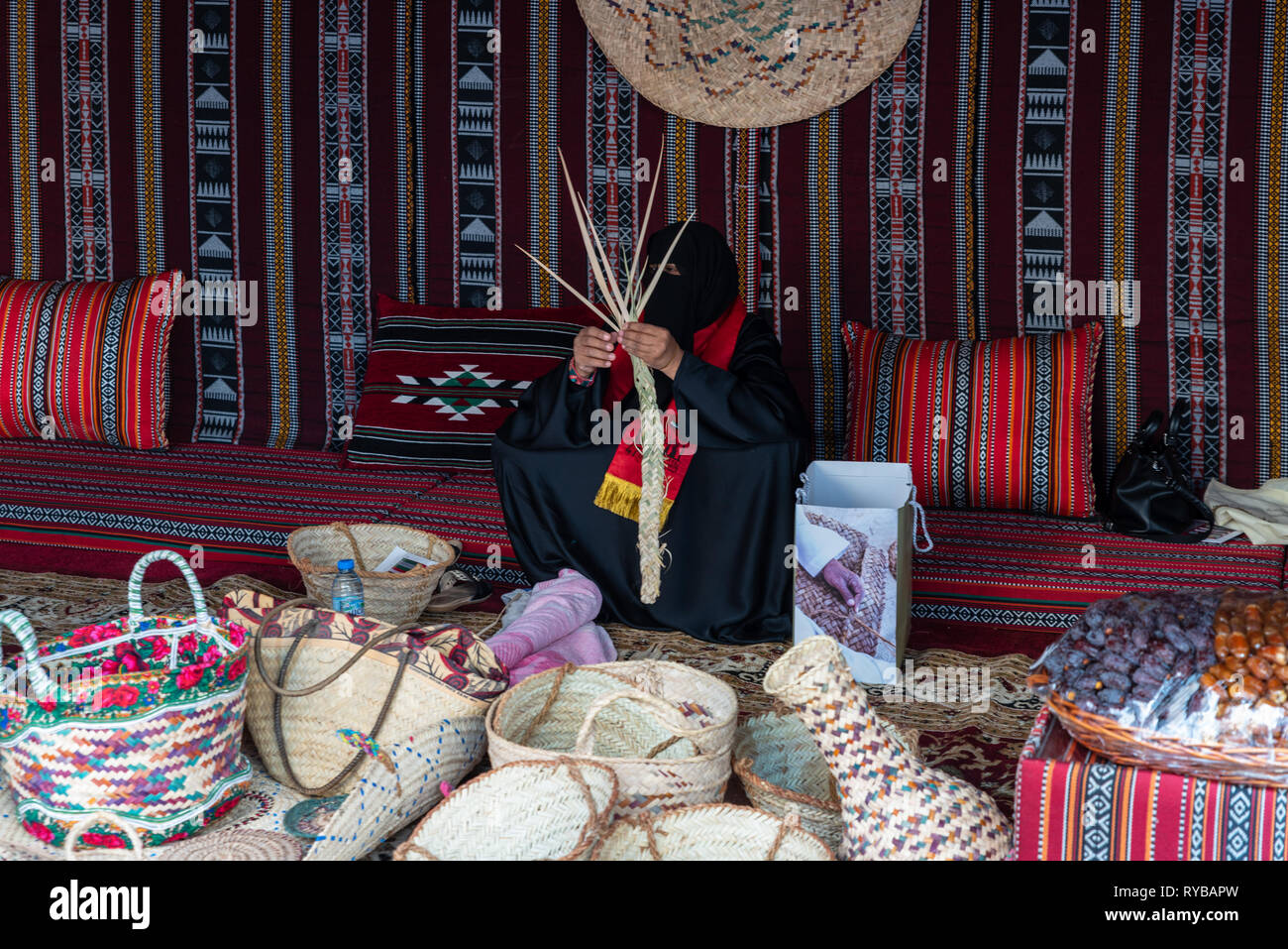 November 28, 2018 - Abu Dhabi, UAE: An Arabi tribal woman handcrafting ...