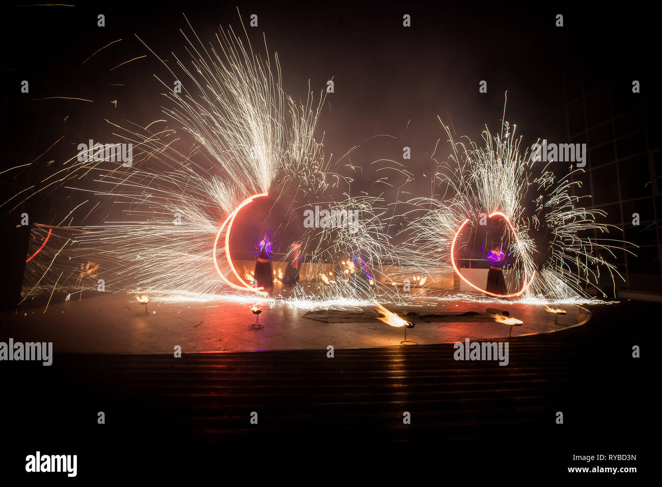 Amazing fire show dance. Fire dancers in beautiful costumes playing ...