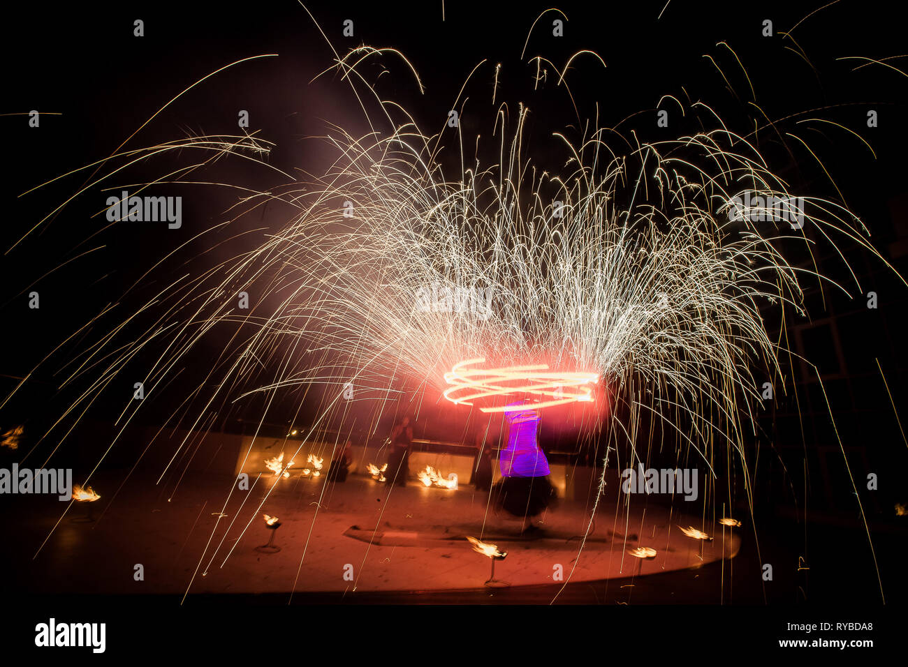 Amazing fire show dance. Fire dancers in beautiful costumes playing ...