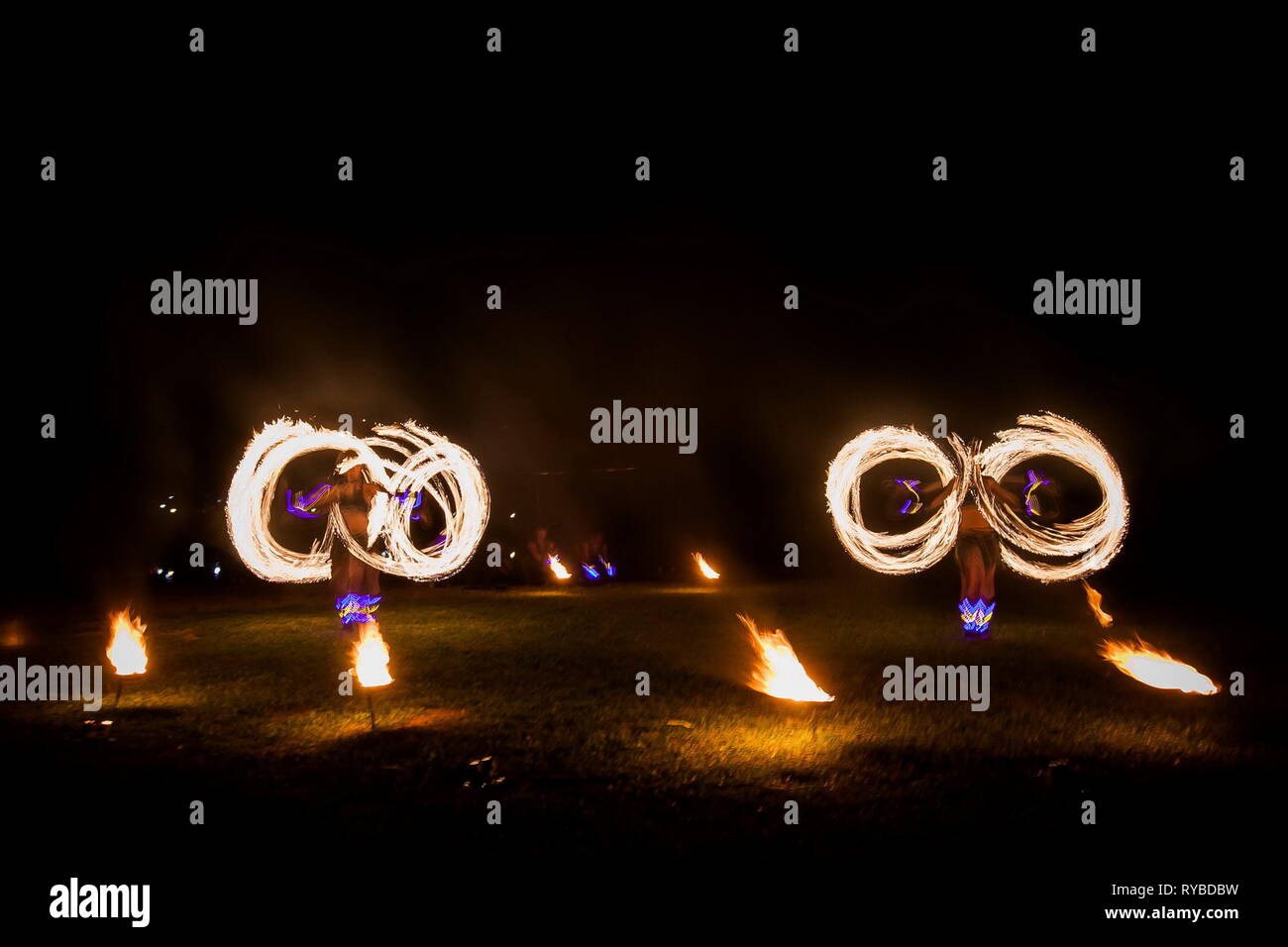Amazing fire show dance. Fire dancers in beautiful costumes playing ...