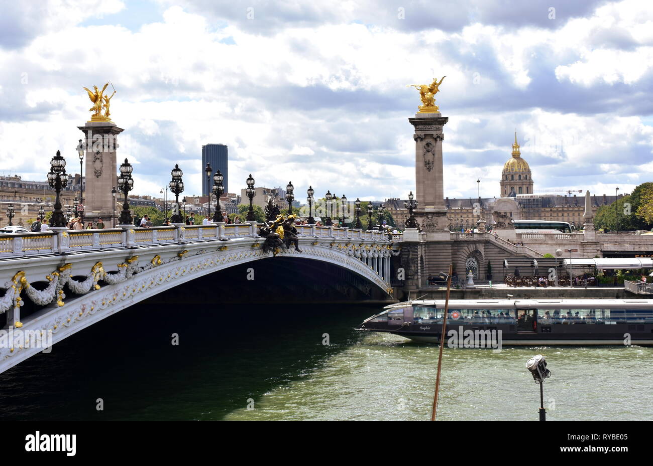 Pont Alexandre III, Les Invalides and Seine River with tourist boat ...