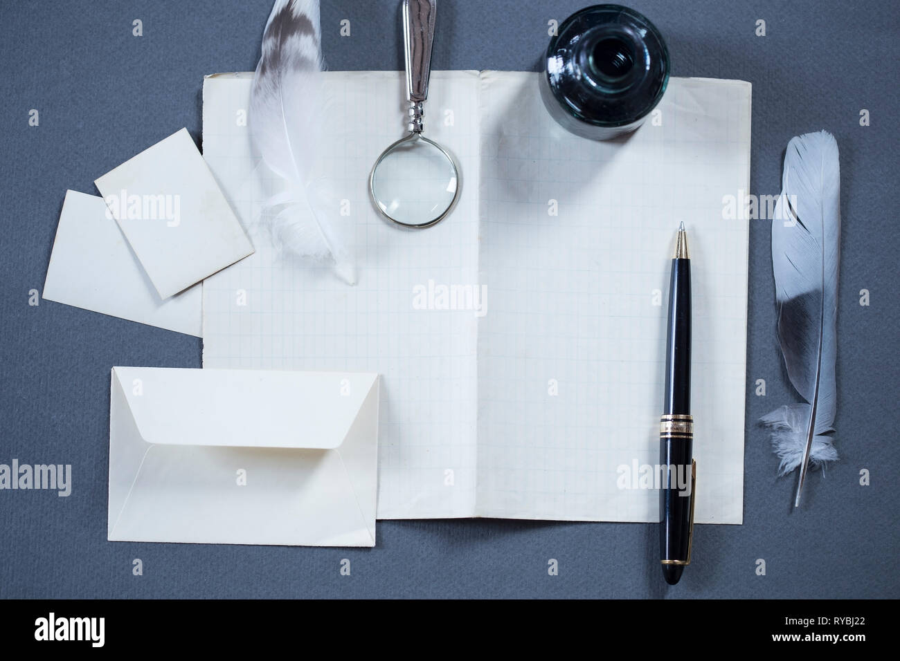 Vintage writing set on a gray cardboard background Stock Photo - Alamy