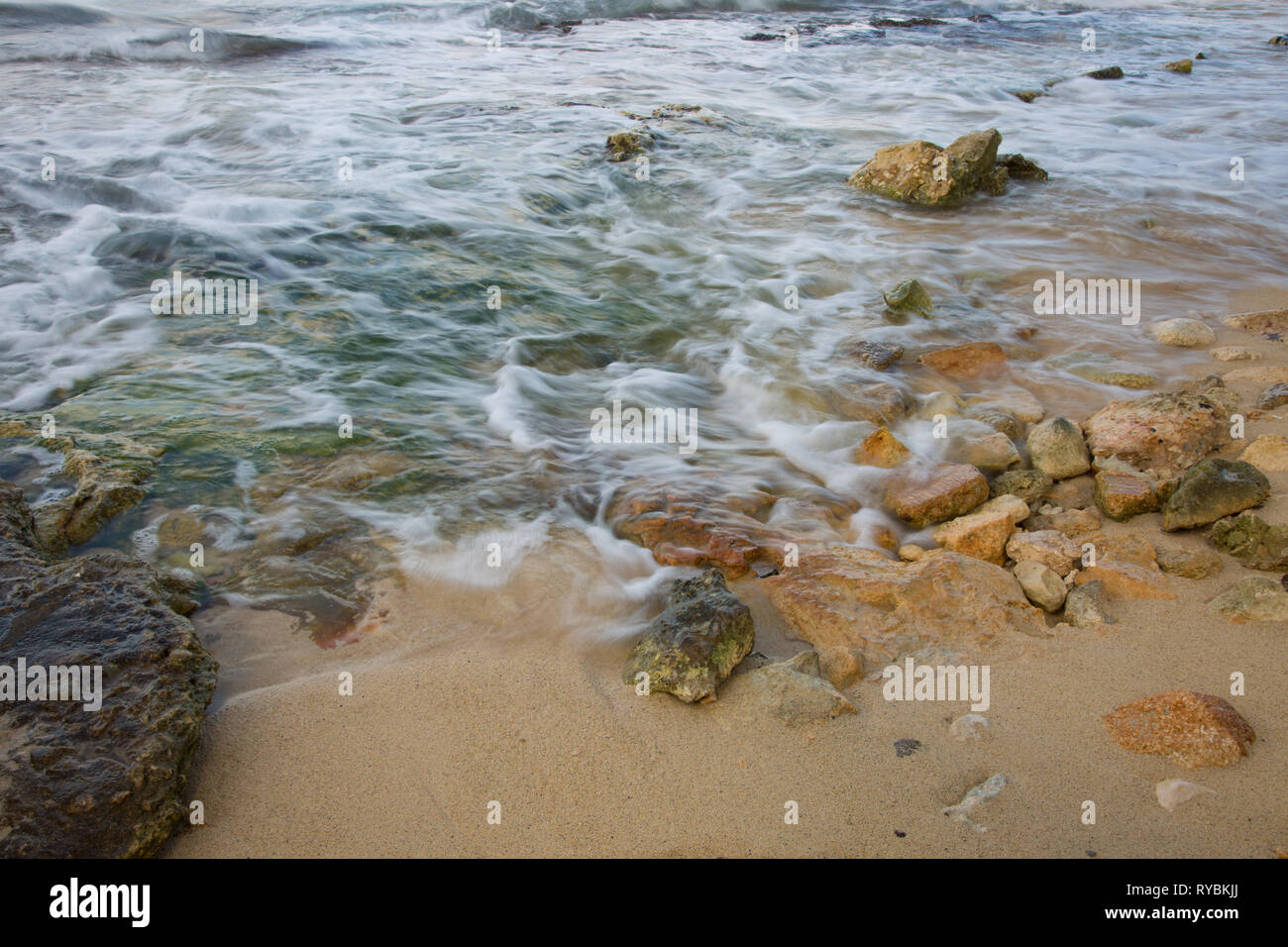Water in slow motion at beach Stock Photo - Alamy