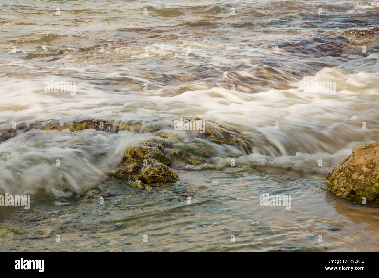 Water in slow motion at beach Stock Photo - Alamy