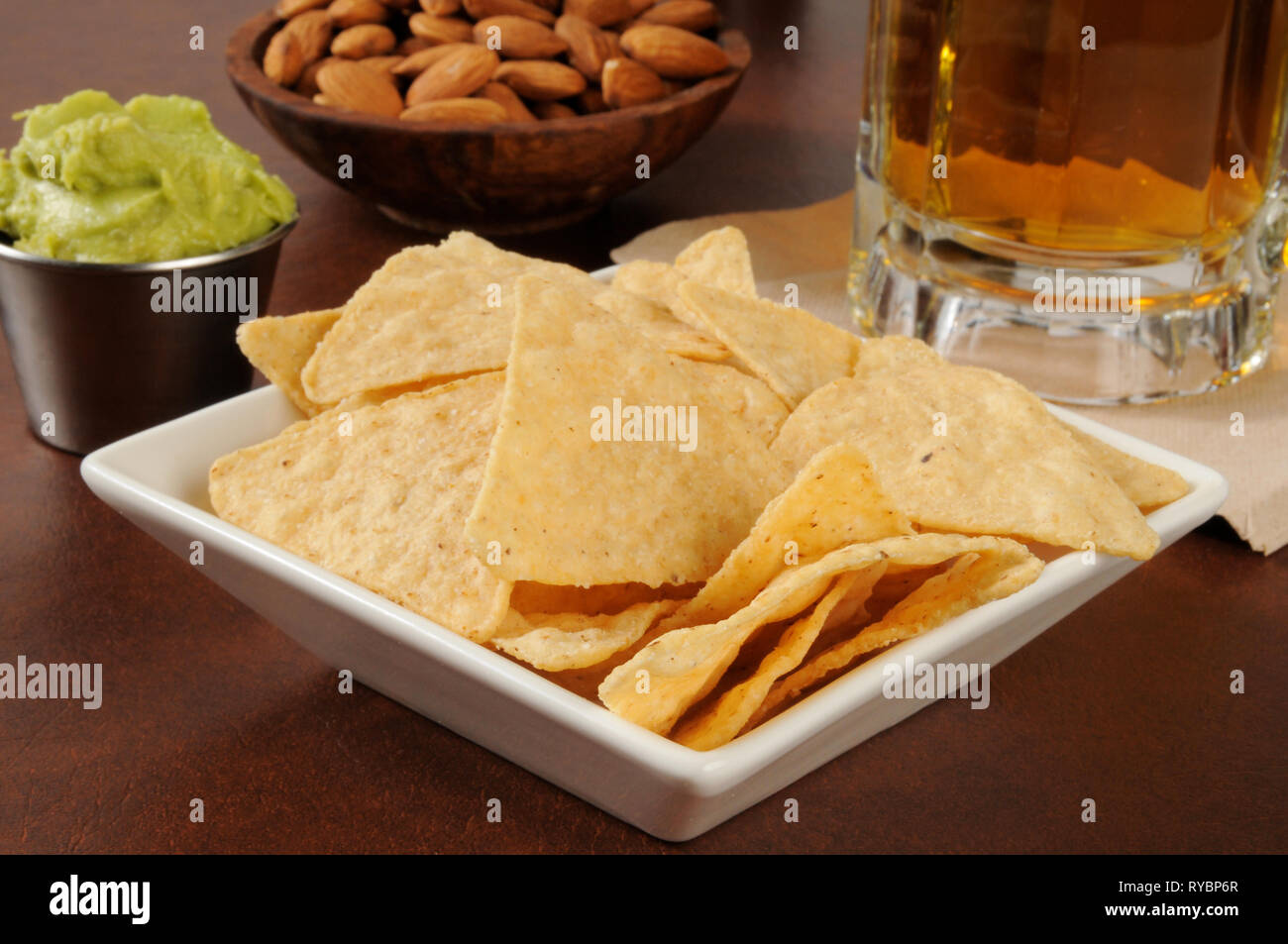 Assorted bar snacks and a mug of beer Stock Photo - Alamy