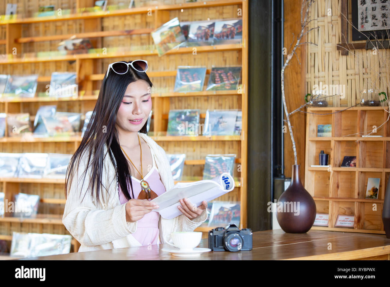 Female tourists who are working online using electronic communication ...