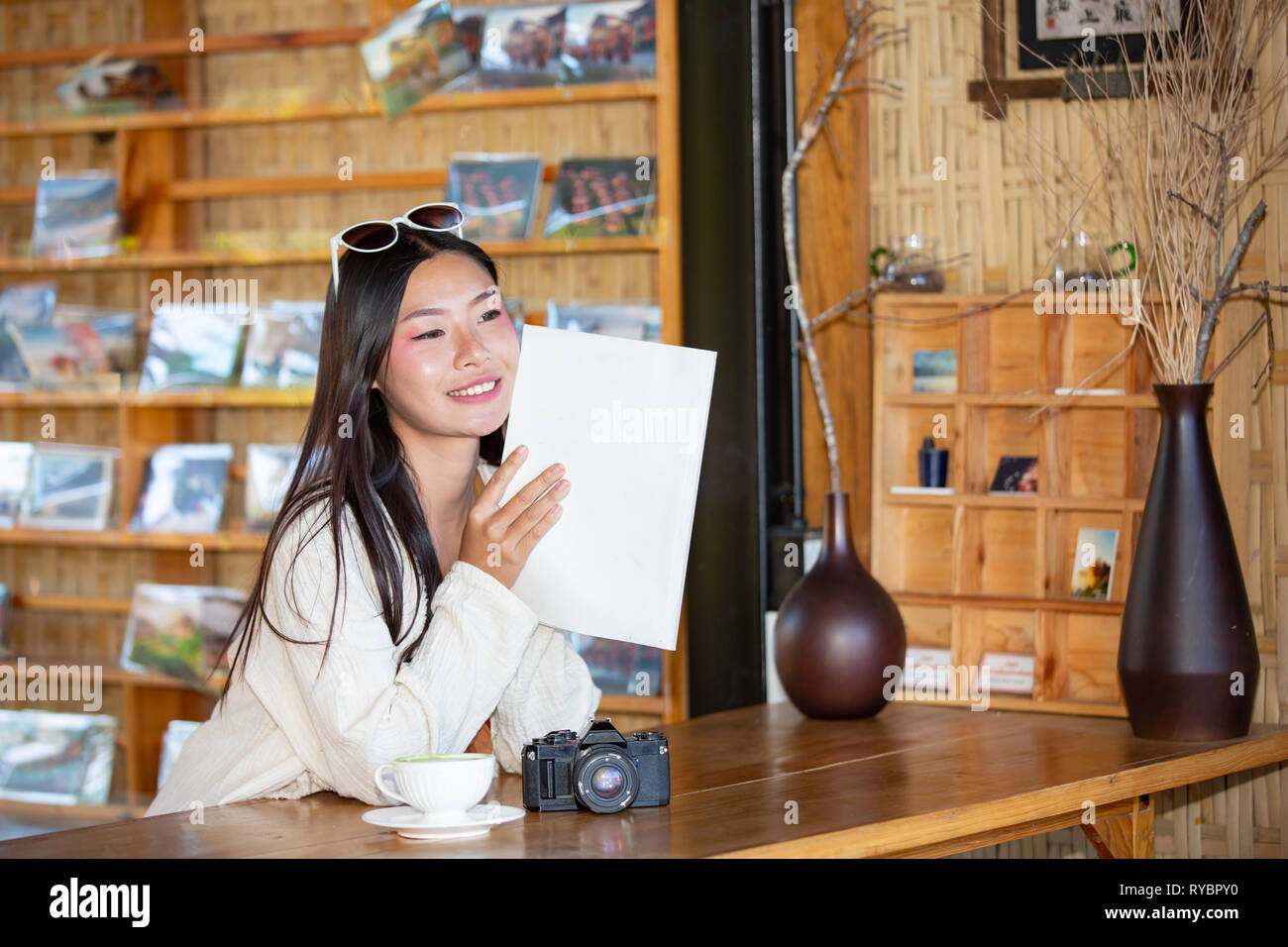 Female tourists who are working online using electronic communication ...