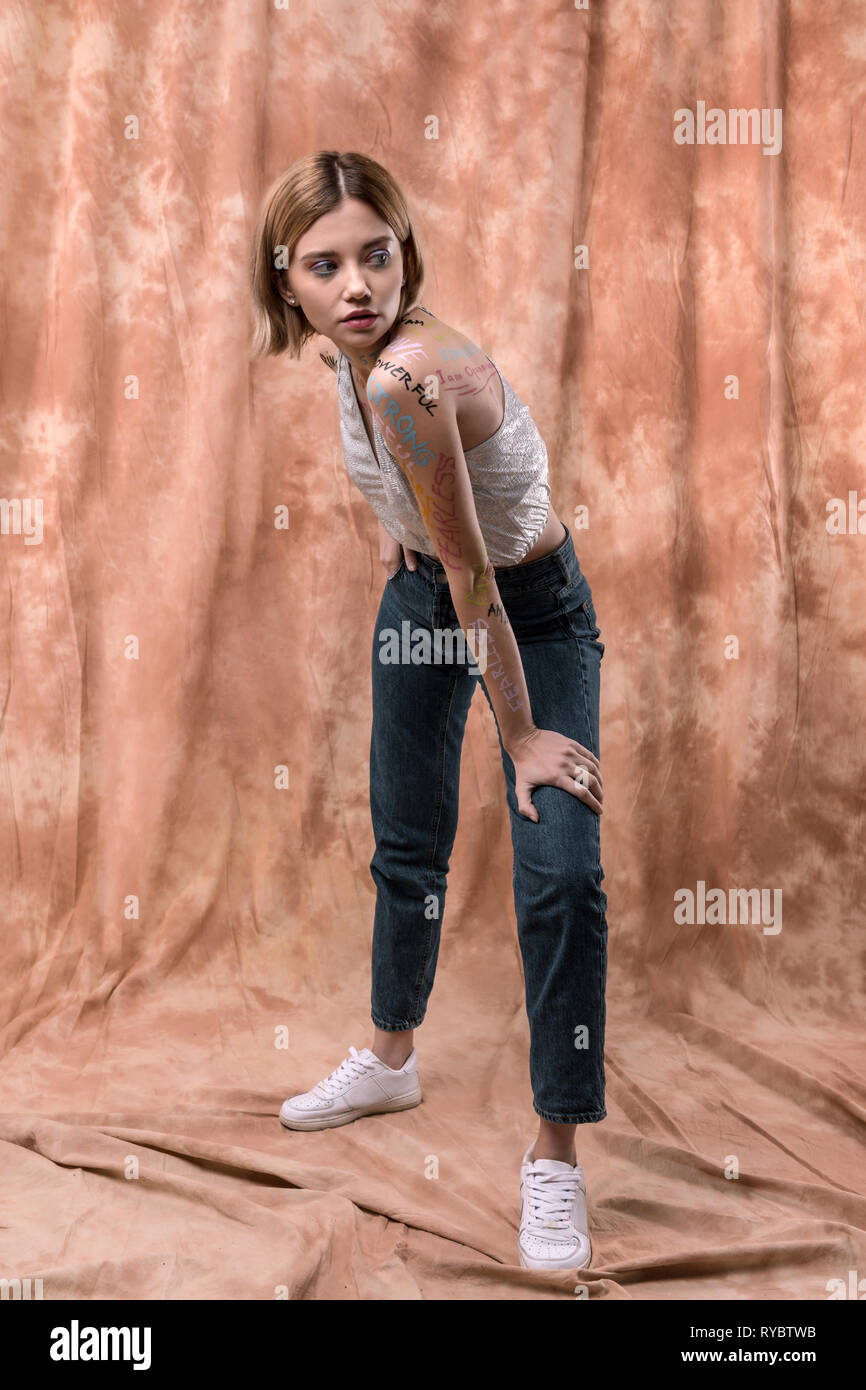 Nice pretty attractive woman touching her knee Stock Photo - Alamy