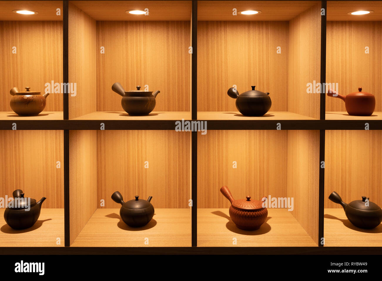 Traditional Japanese pots used for tea ceremony on grid shelves Stock ...