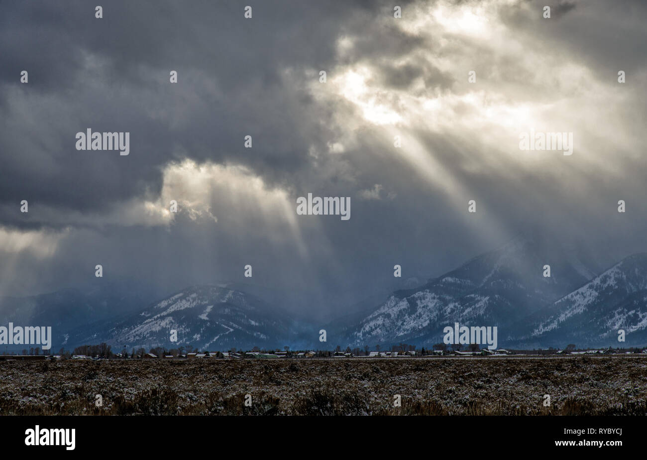 Sun's Rays Breaking Through the Storm Clouds, Highlighting the Teton Mountain Range Stock Photo ...