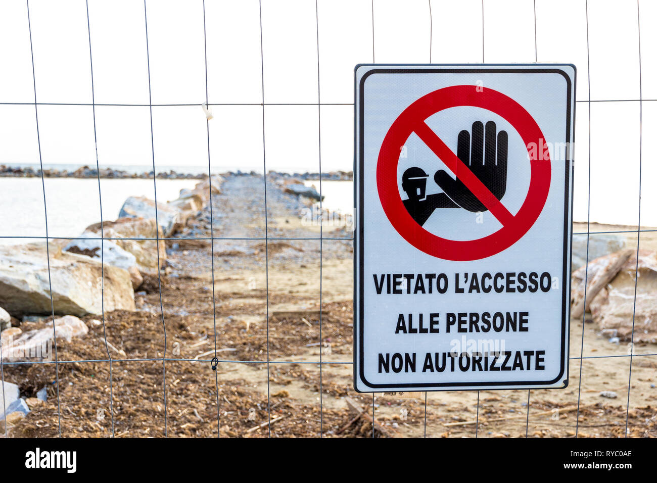 Warning sign reading: 'no entry unauthorised personnel' near a ...