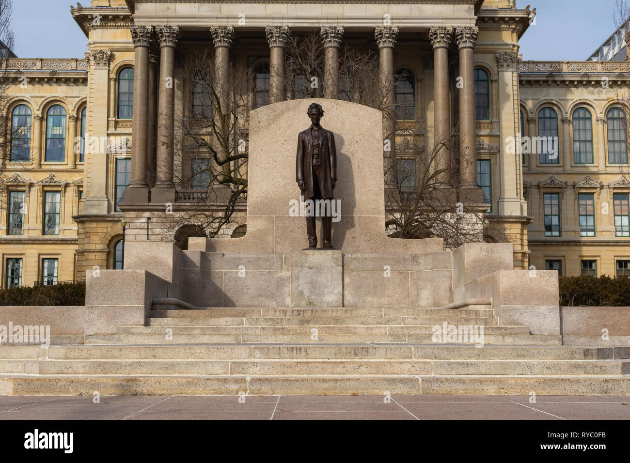 Statue of Abraham Lincoln and State Capitol Building on a Spring ...