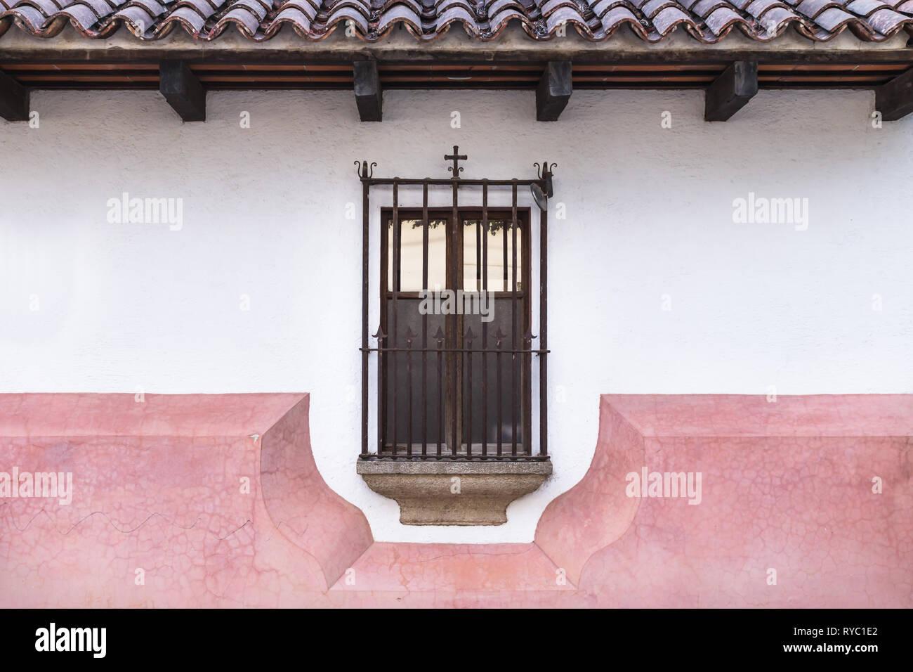Caged window in colonial style with cross decoration in Antigua ...
