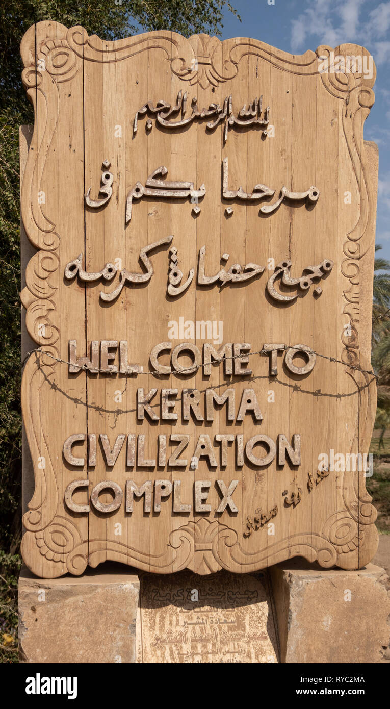 Kerma, Sudan, February 8., 2019: Solid wood sign at the entrance of the ...