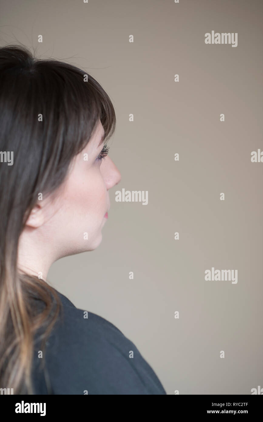 Side view of a woman looking away Stock Photo - Alamy