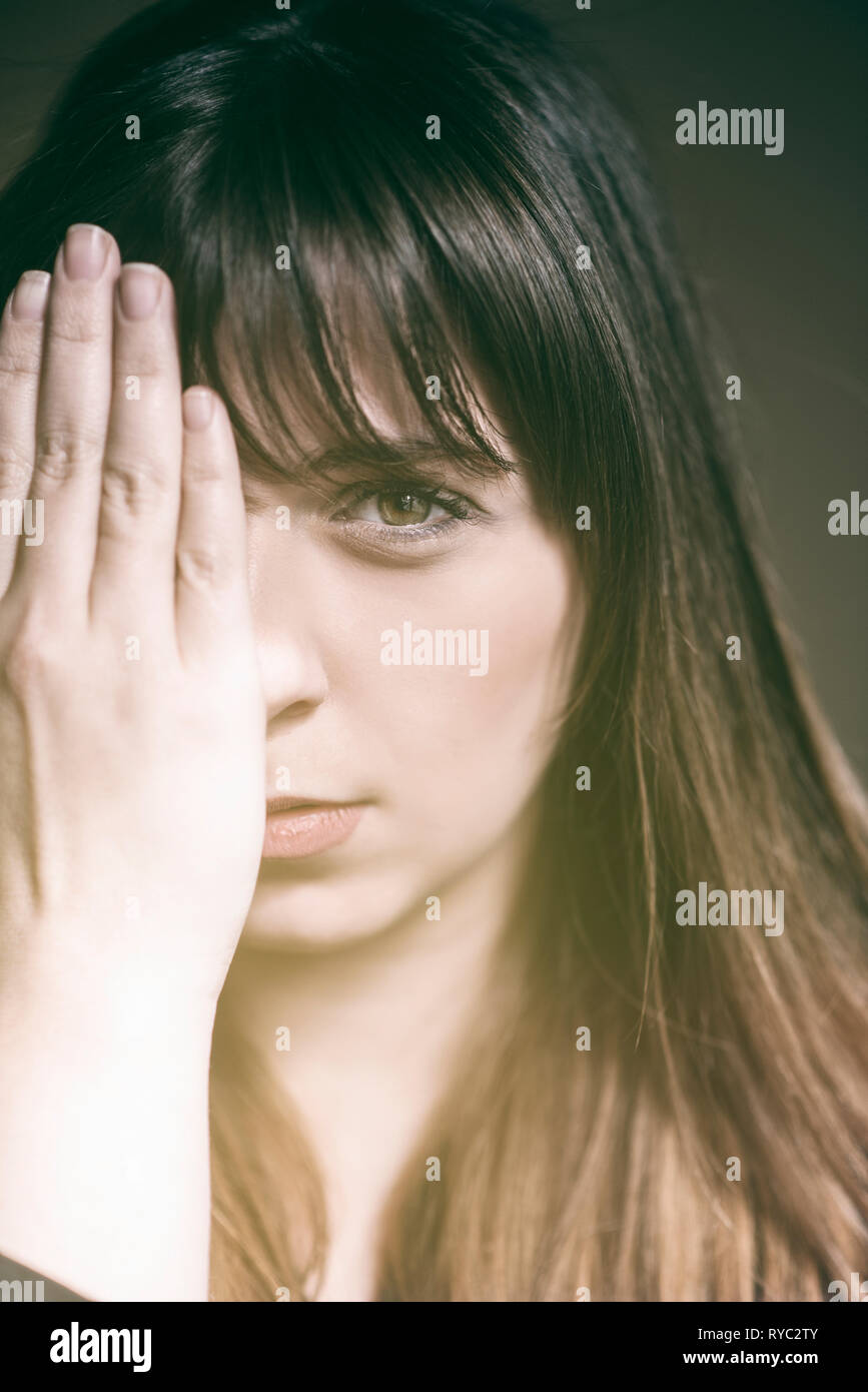 Hand covering eye hi-res stock photography and images - Alamy