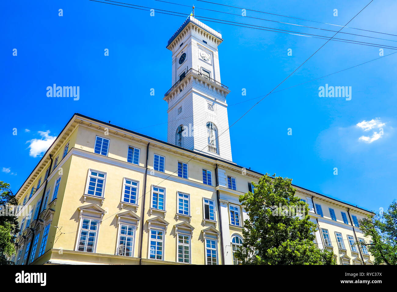 Lviv Town Hall Side Low Angle View with Waving Ukrainian Flag on Roof ...