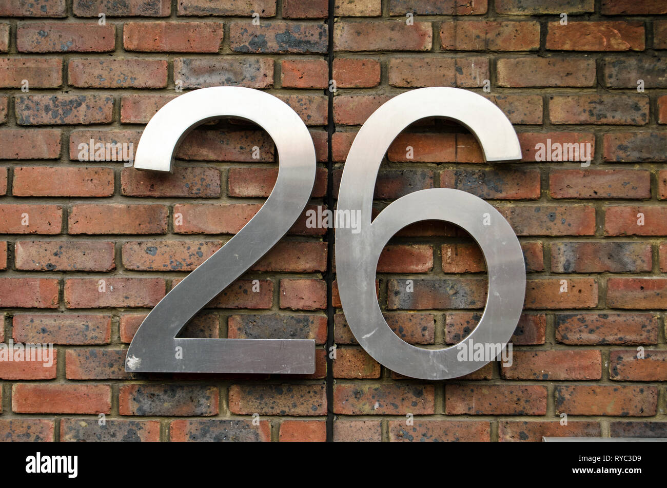 Figures for the number twenty six attached to the outside wall of an ...