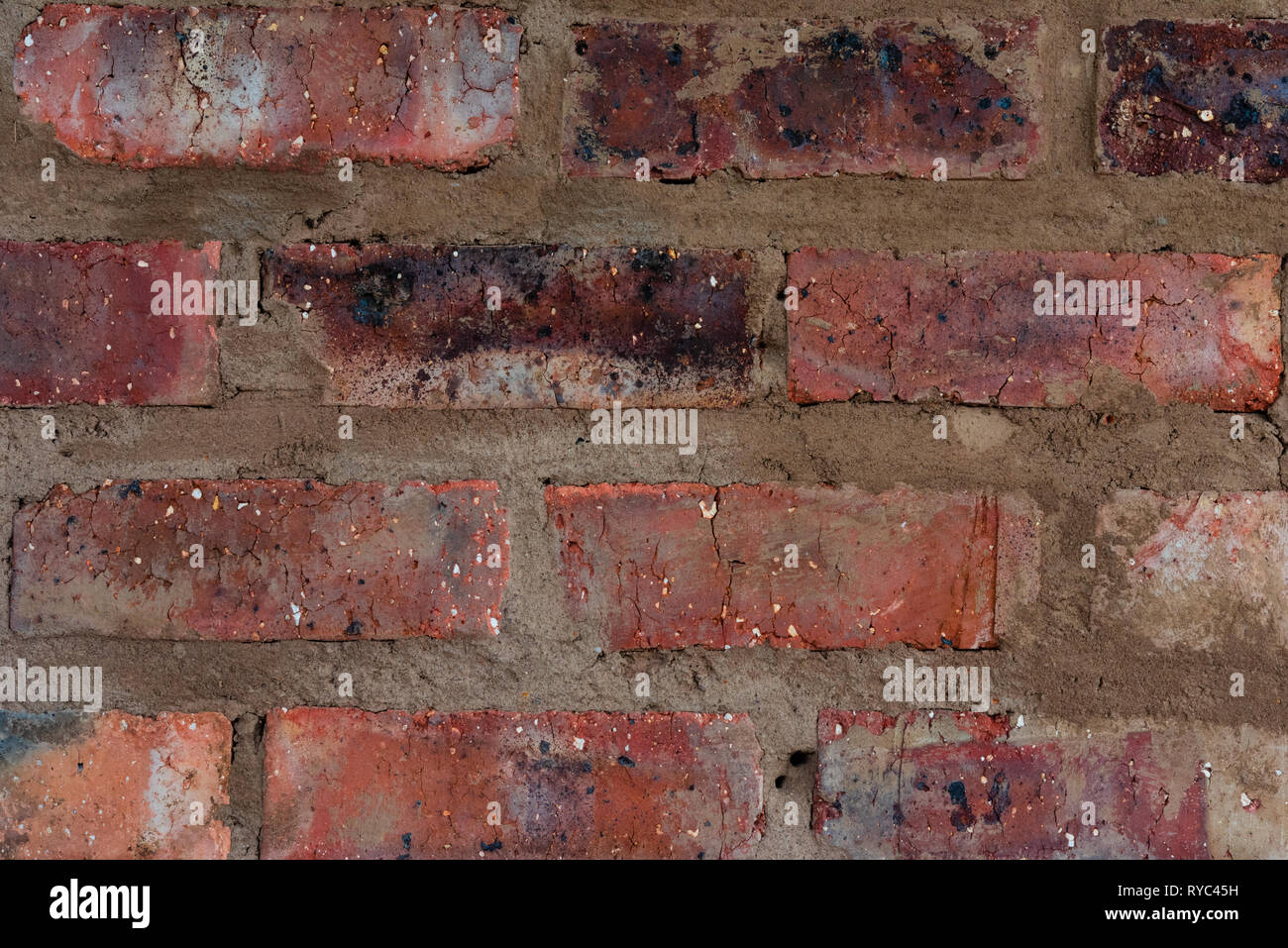 A background of a rough, textured brick wall Stock Photo - Alamy