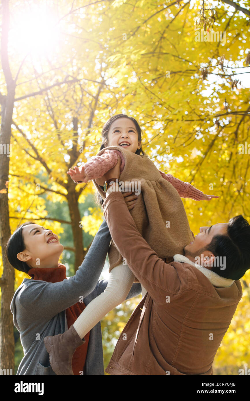 Three play outdoors Stock Photo - Alamy