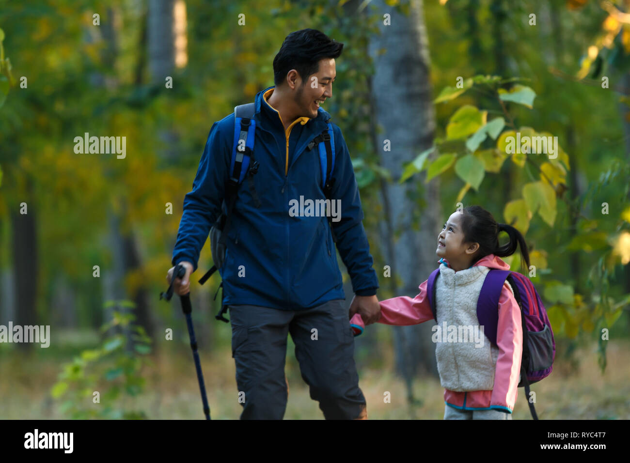 Dad hiking with children Stock Photo - Alamy