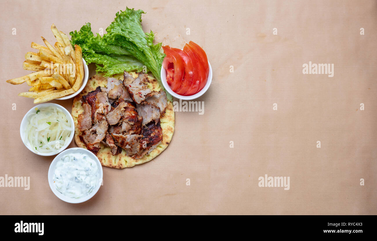 Gyro pita ingredients. Shawarma, gyros, pita bread, vegetables and ...