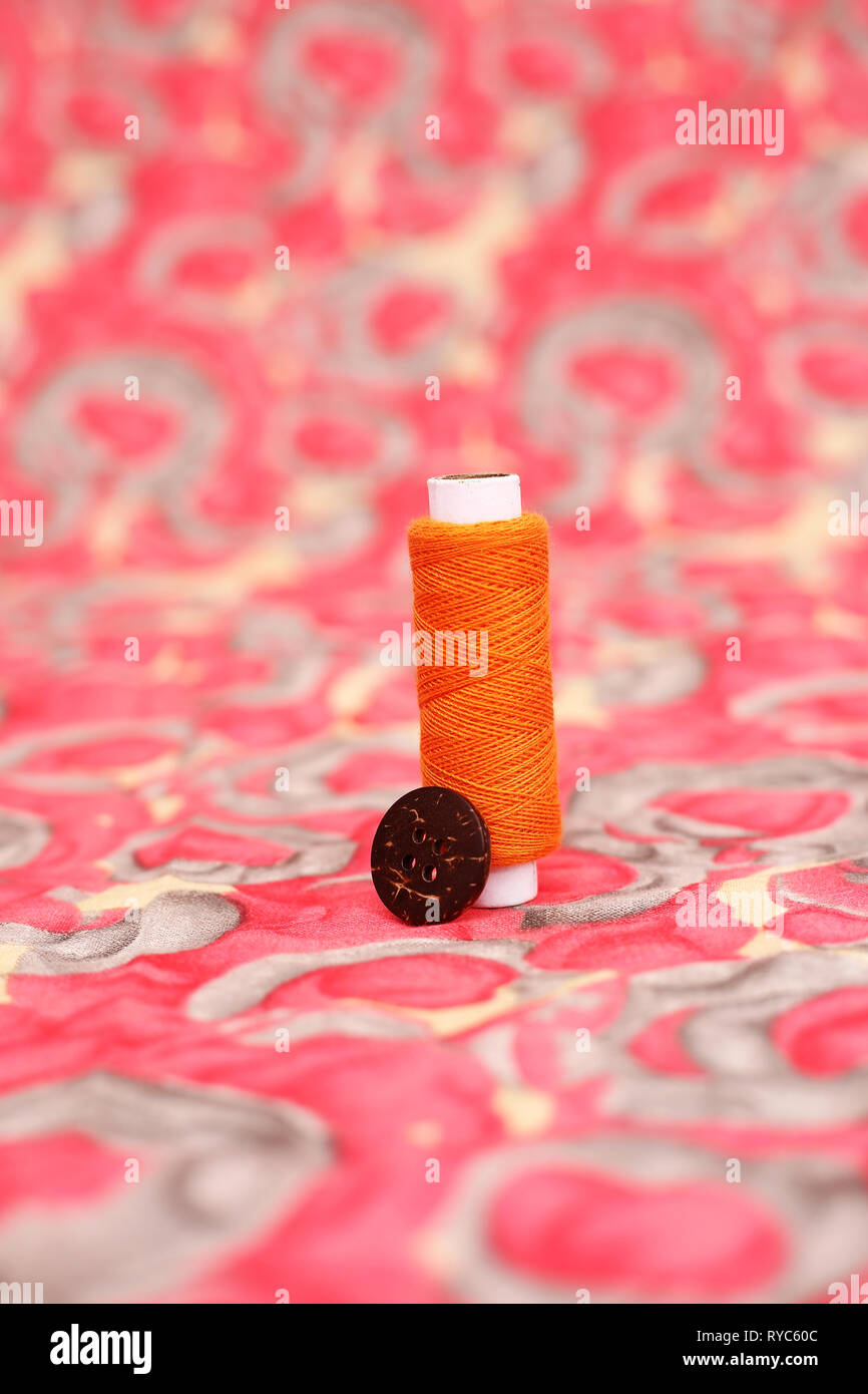 thread Picture of thread and button. Isolated on the colorful ...