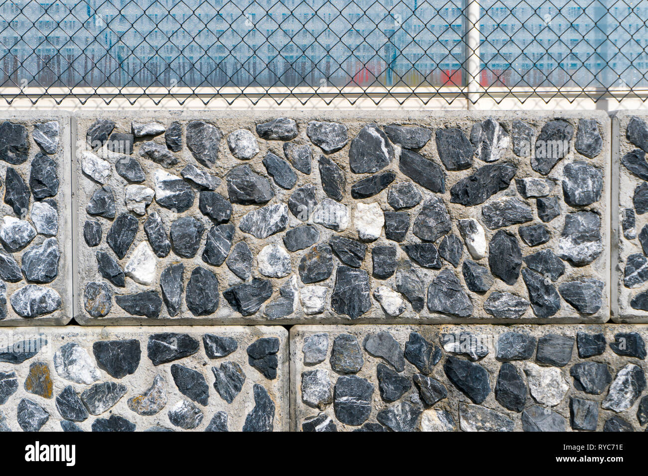 horizontal detail of a rock wall background made of small jagged ...