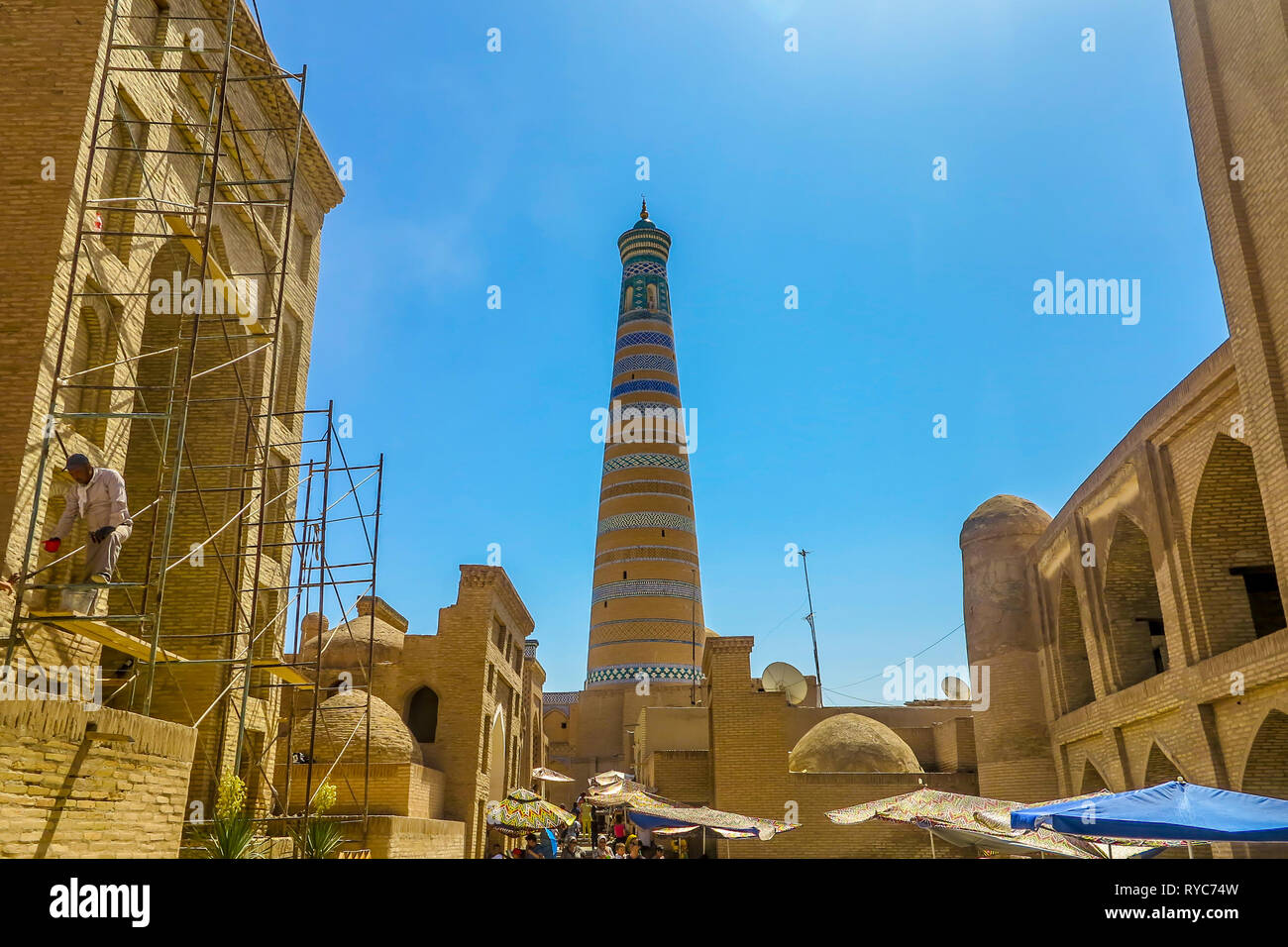 Khiva Old Town Juma Mosque and Islam Khoja Minaret with Worker ...
