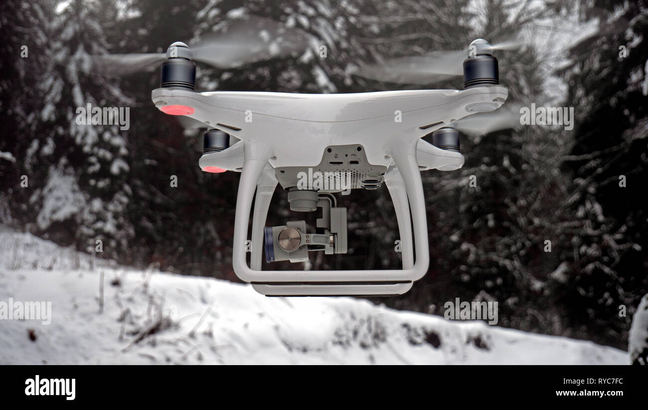 Close up photo of a hovering drone. The Aerial UAV is pictured in a ...