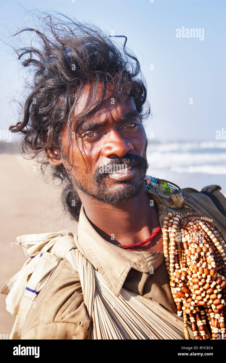 An Indian gypsy bead seller on a beach in India Stock Photo - Alamy