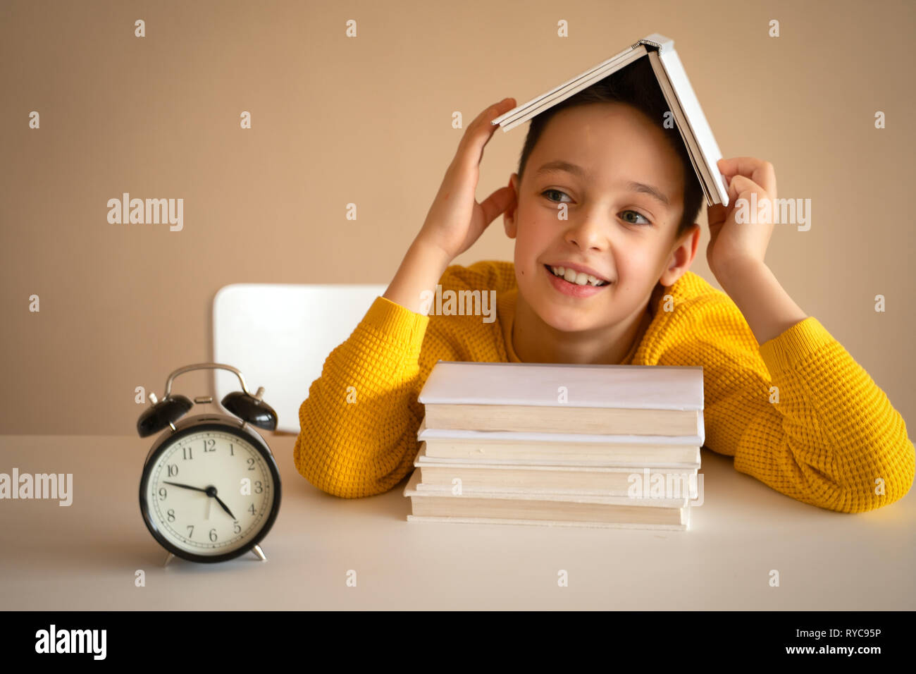 Thinking child bored, frustrated and fed up doing his homework Stock ...