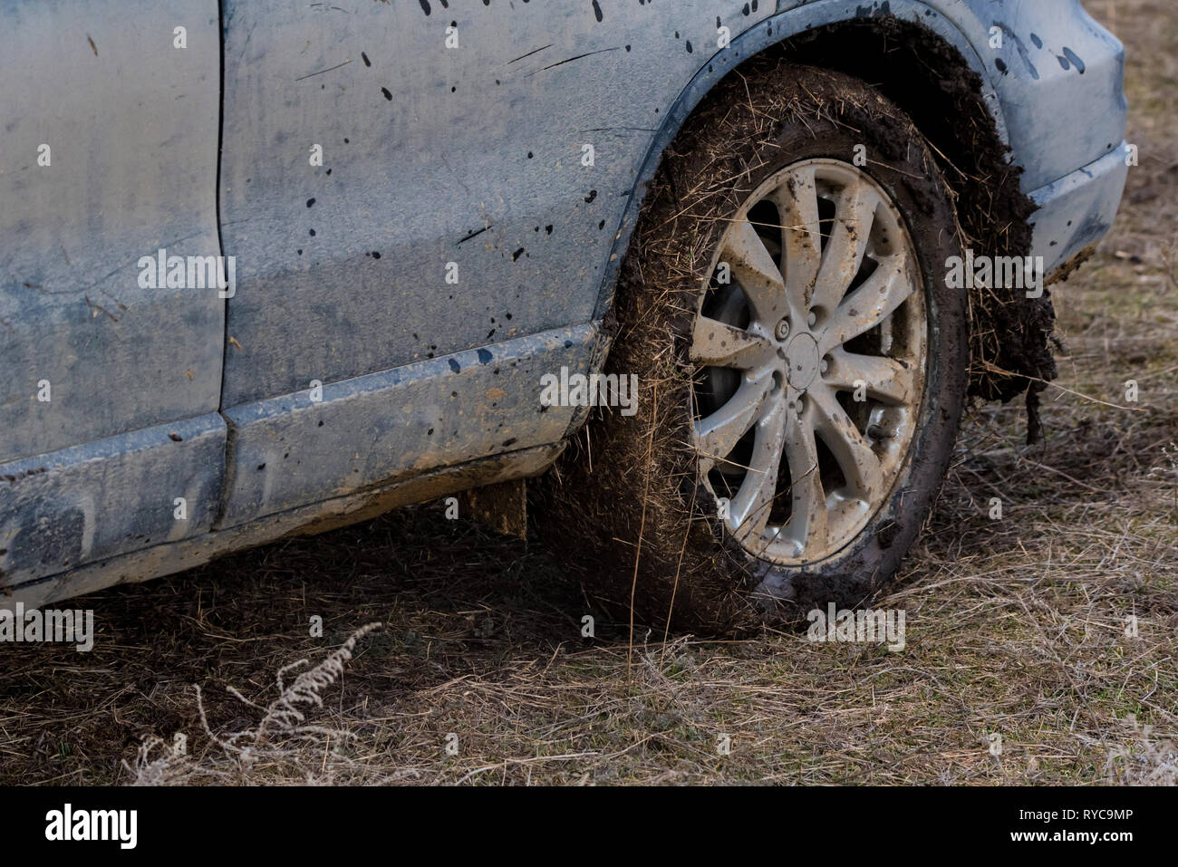 Close up dirty car with dry mud on tires Stock Photo - Alamy