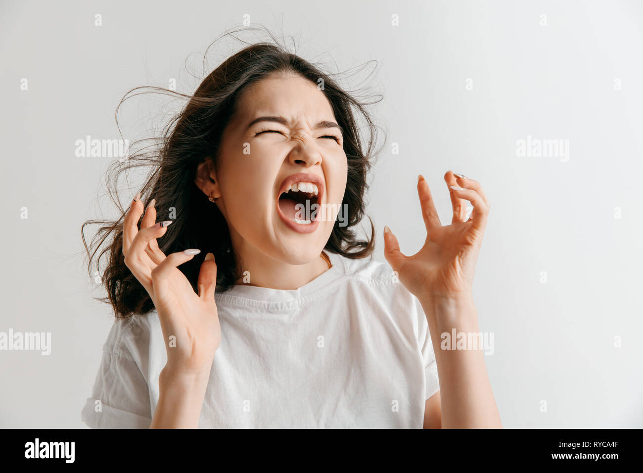 Screaming, hate, rage. Crying emotional angry asian woman screaming on ...